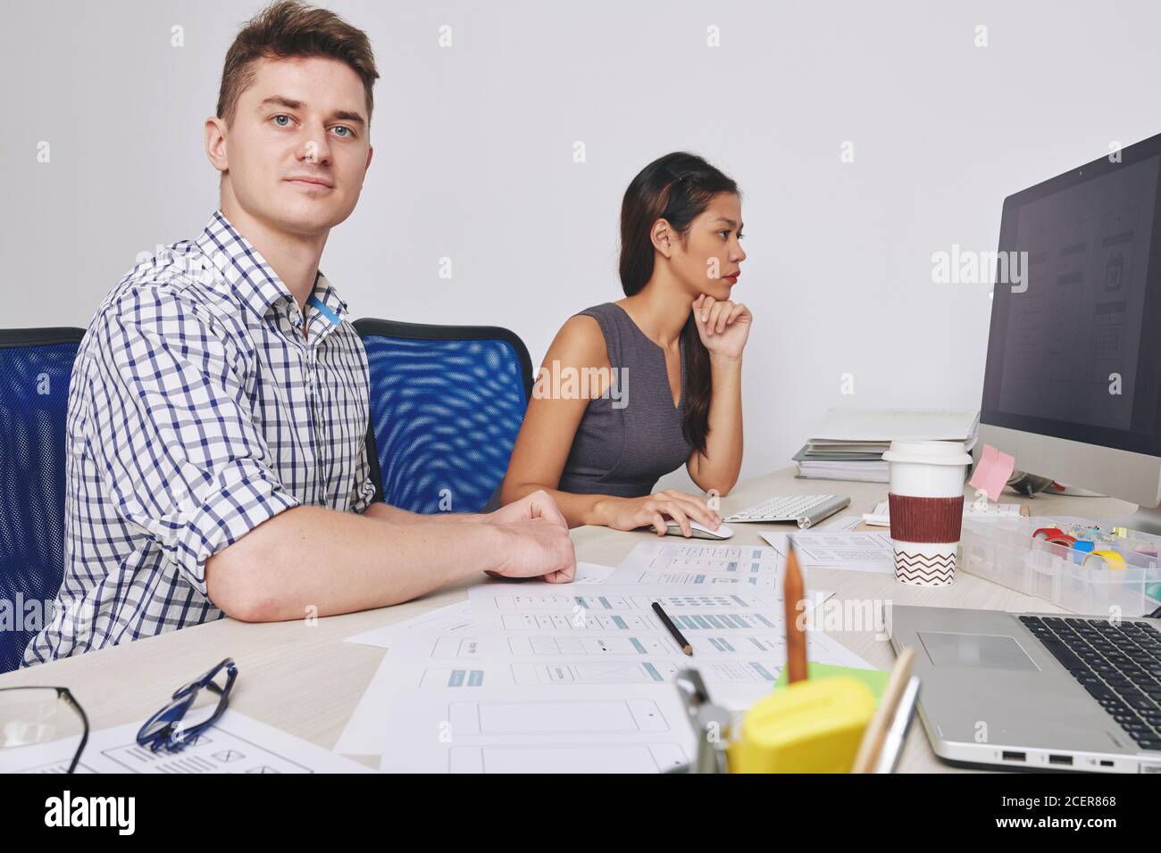 Working on mobile app interface Stock Photo - Alamy