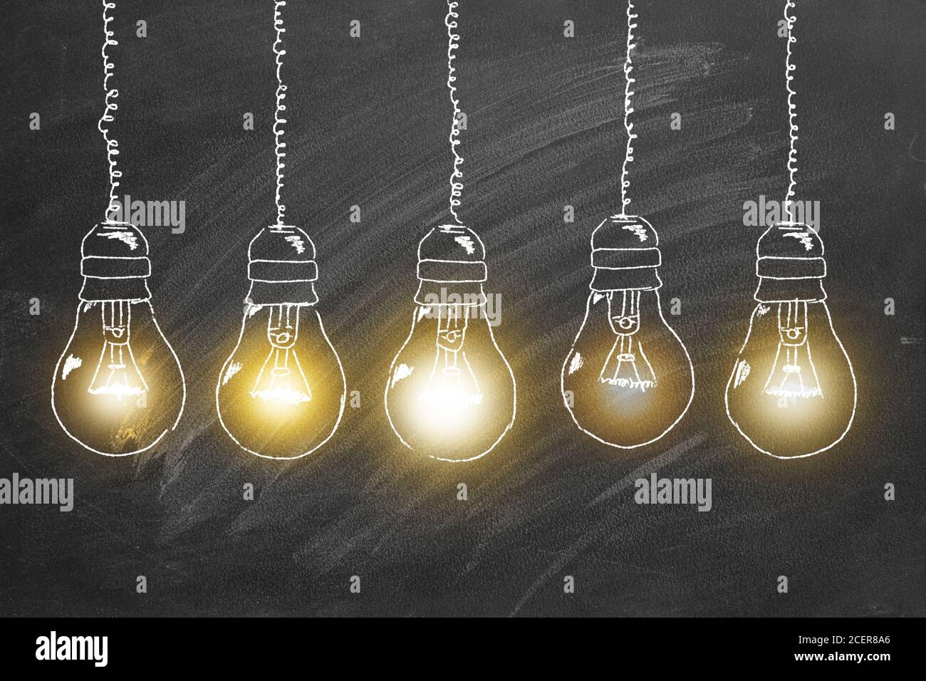 Row of tungsten light bulbs drawn in chalk on a blackboard. Concept of ...