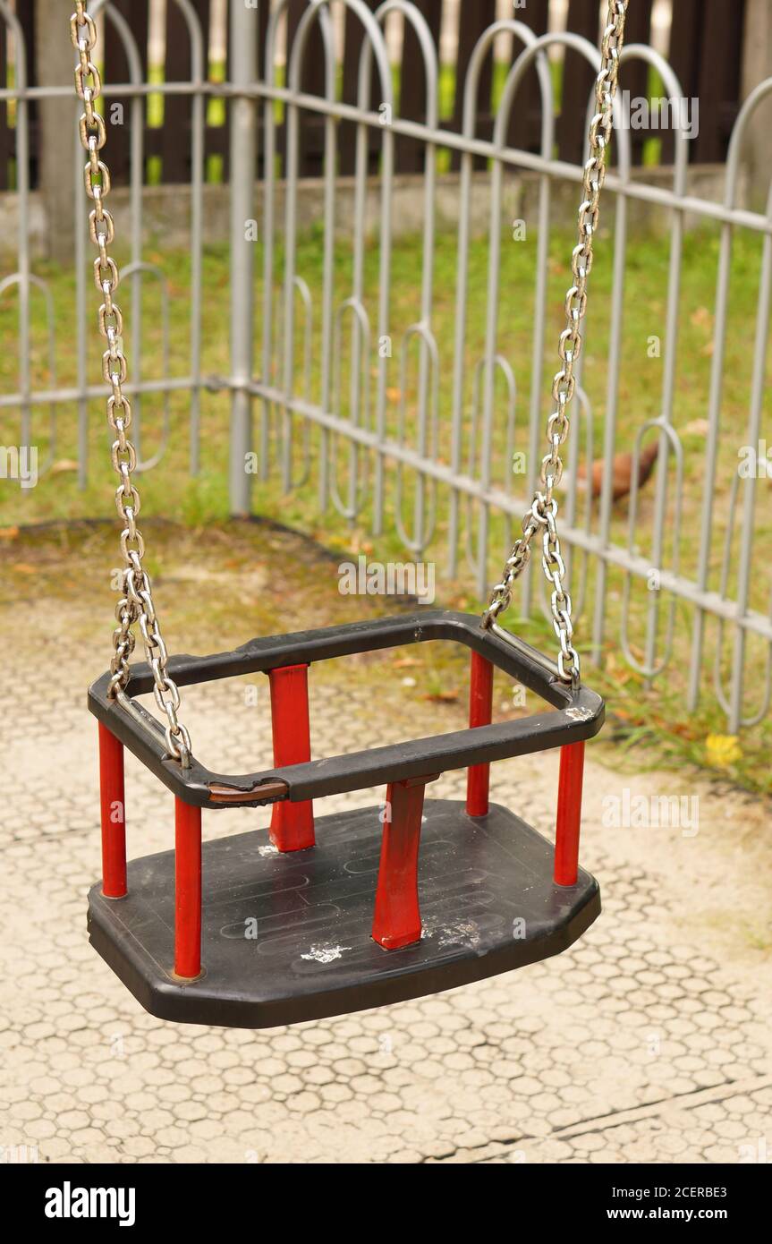 Seat and chains of a swing s Stock Photo - Alamy
