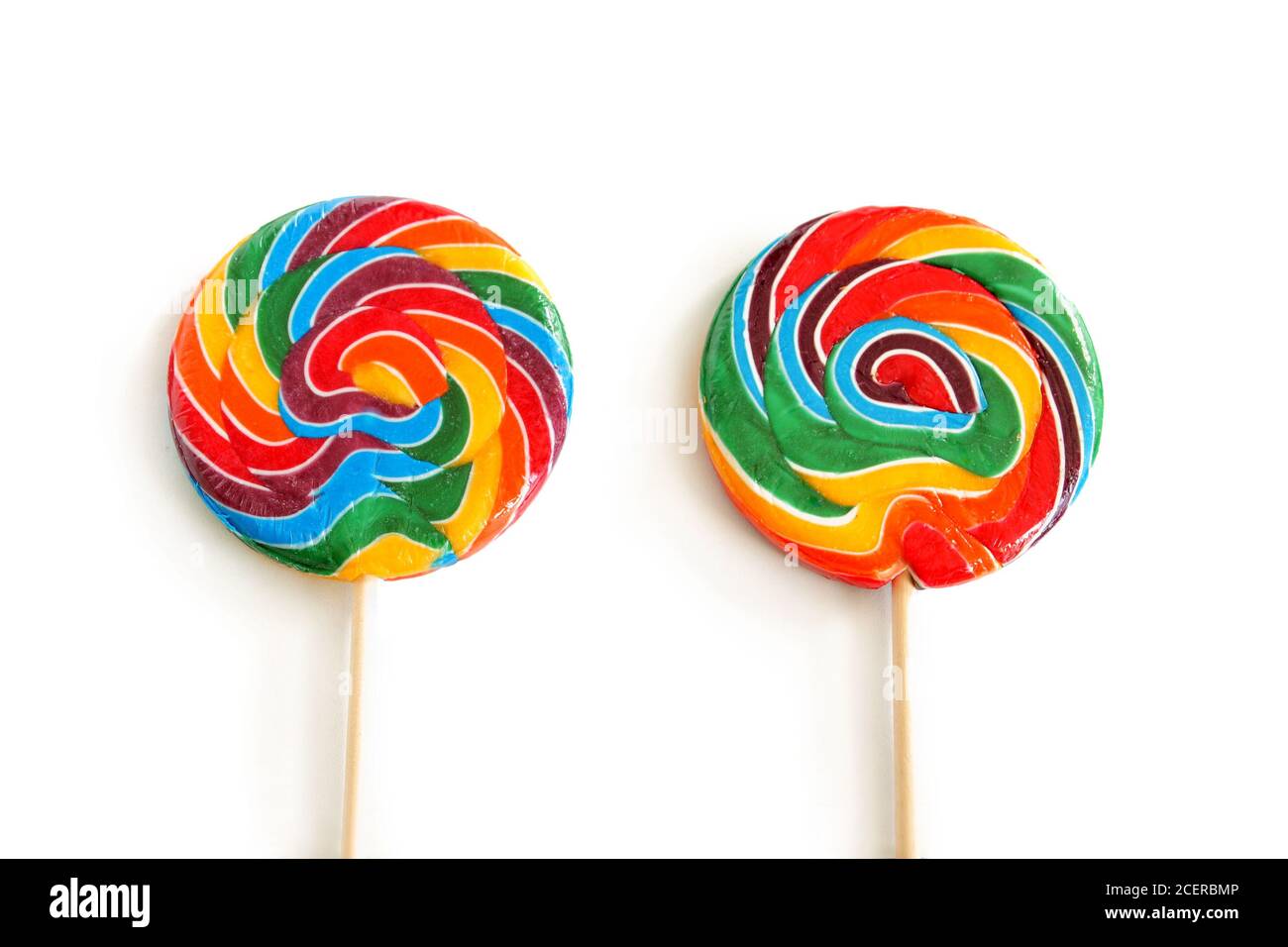 Two colorful lollipops isolated on white background Stock Photo - Alamy