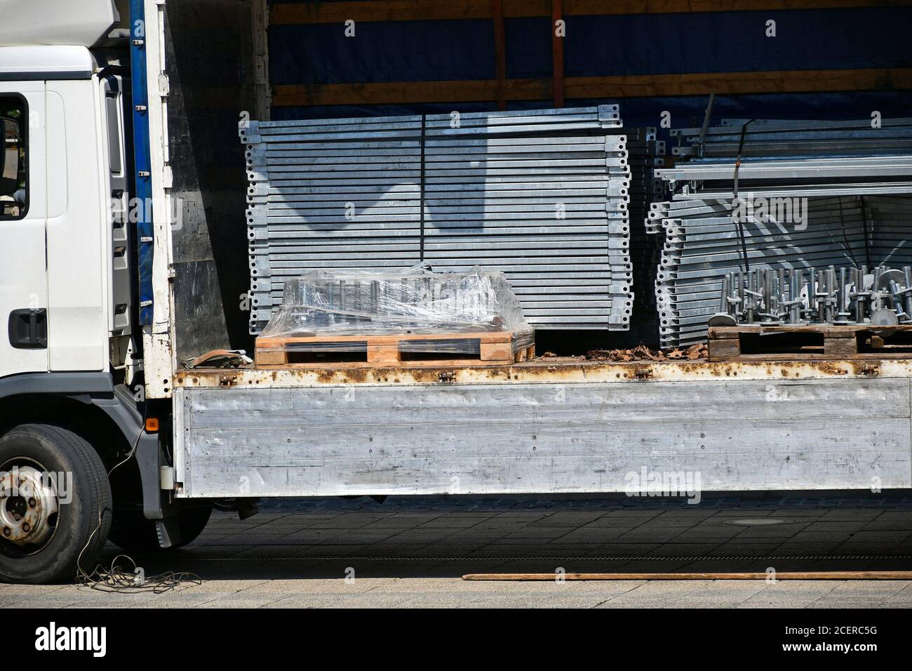 Truck delivering metal parts at the construction site Stock Photo - Alamy