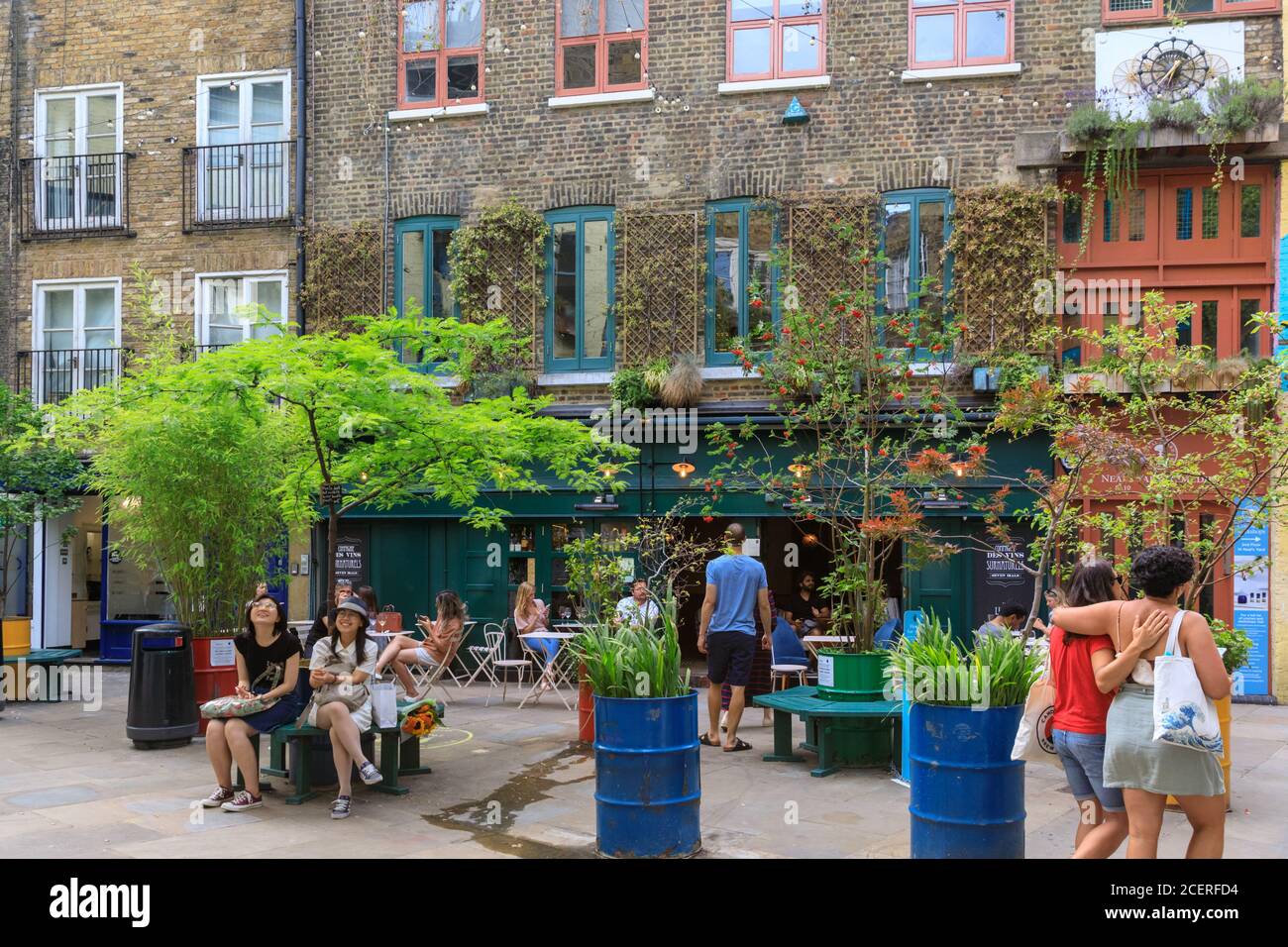 People in Neil's Yard, outdoor cafes and pop ups in trendy urban health ...