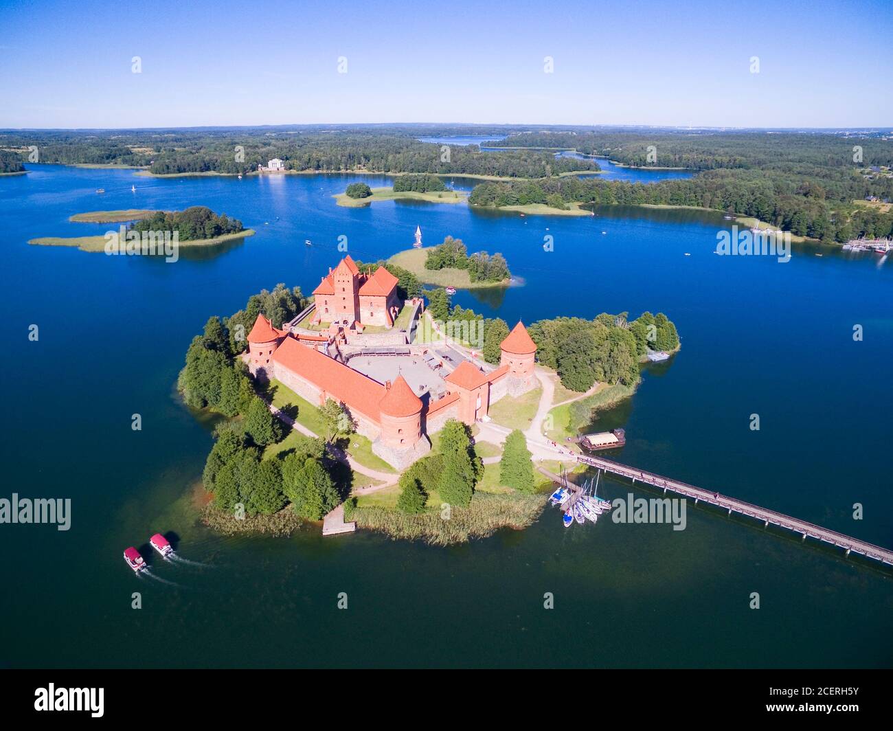 Aerial view of beautiful Gothic style red brick castle on an island on ...