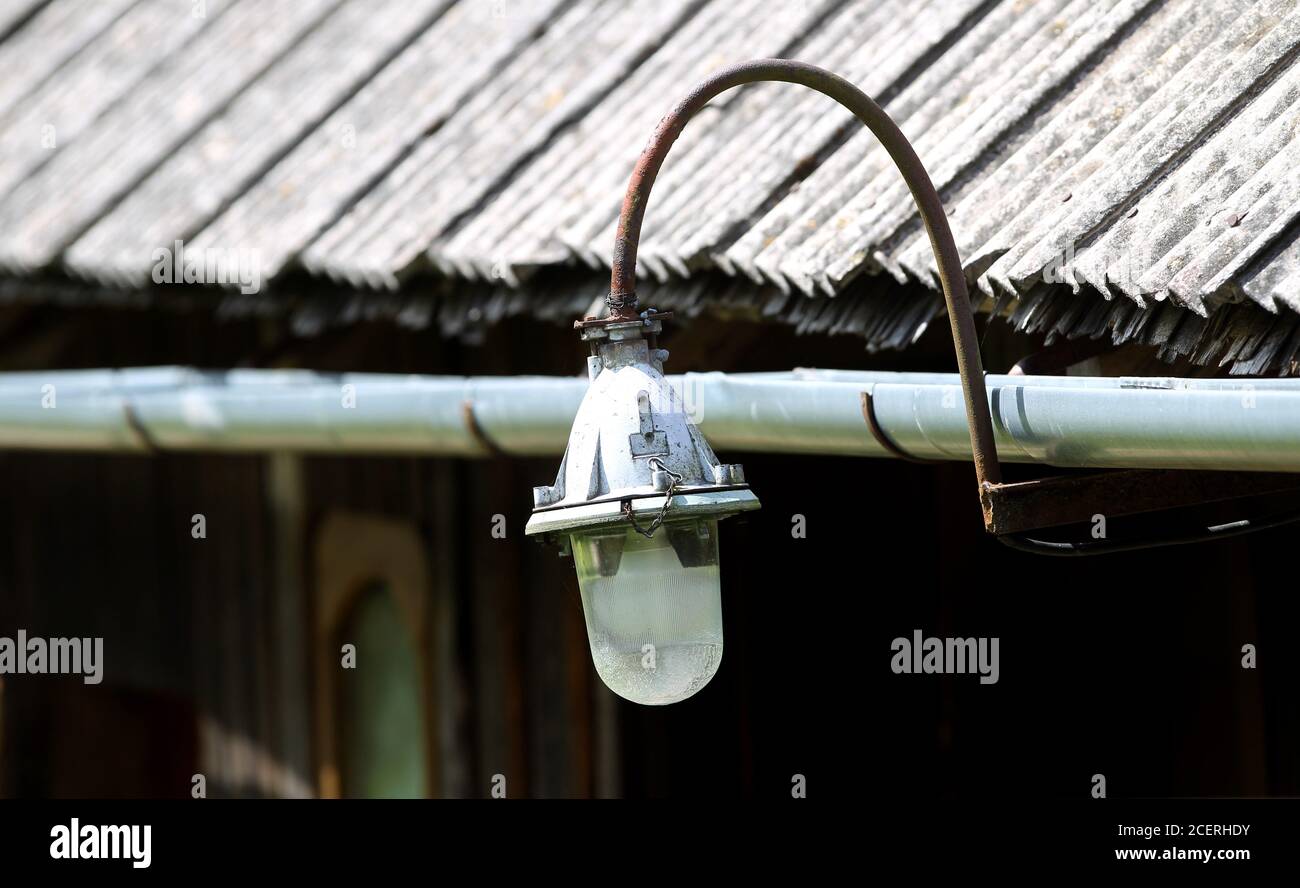 A classic old street lamp by the old roof Lithuania Stock Photo - Alamy