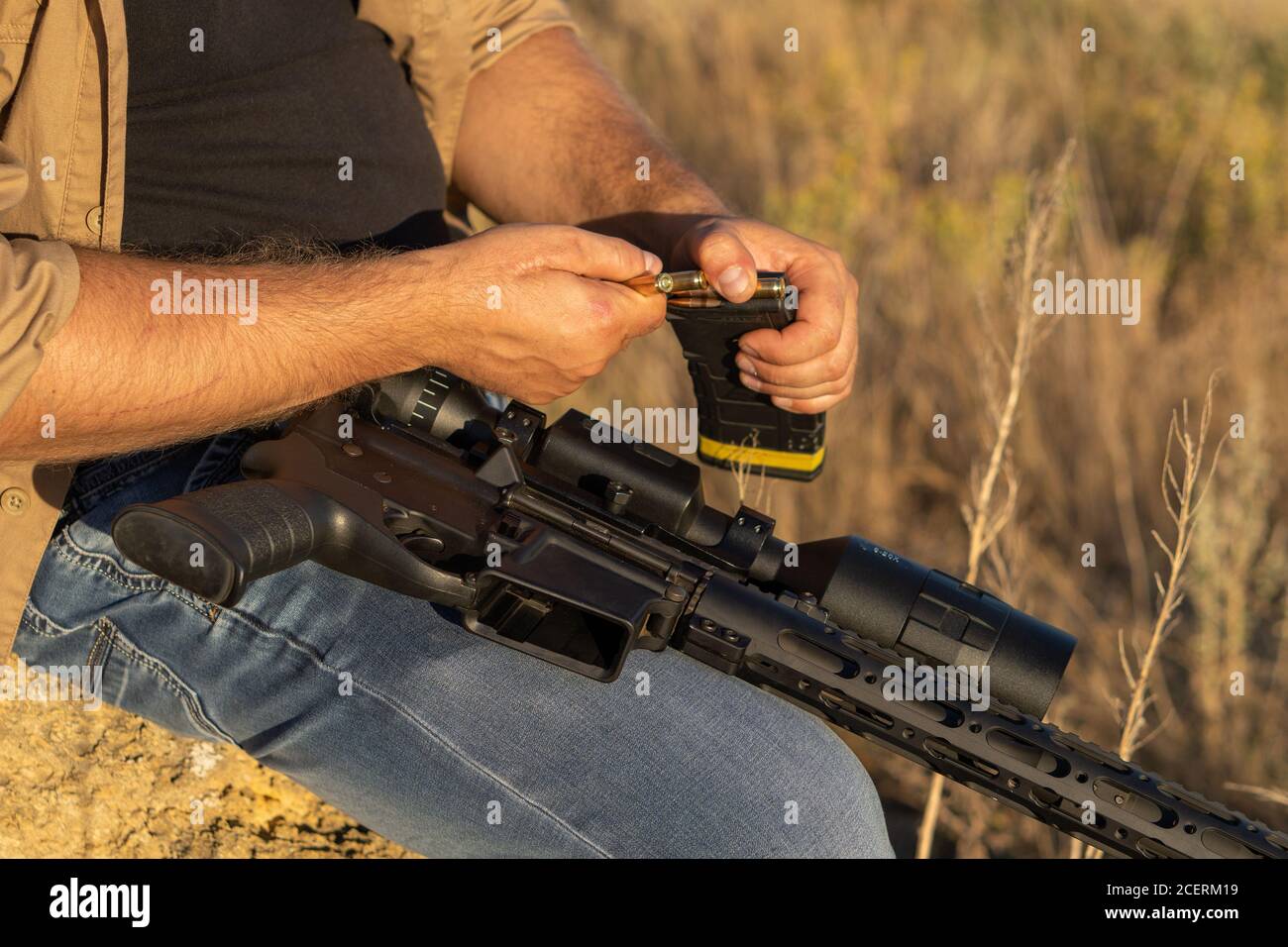 A rifle in a man's hand, close-up. Hunter with a weapon on the hunt ...