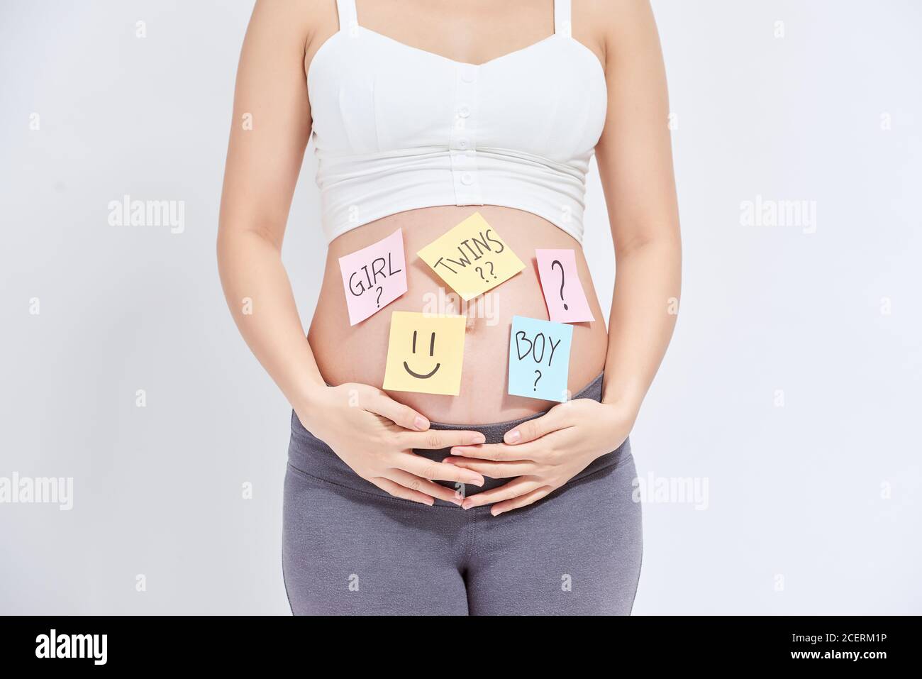 Pregnant woman with stick notes on her belly Stock Photo - Alamy