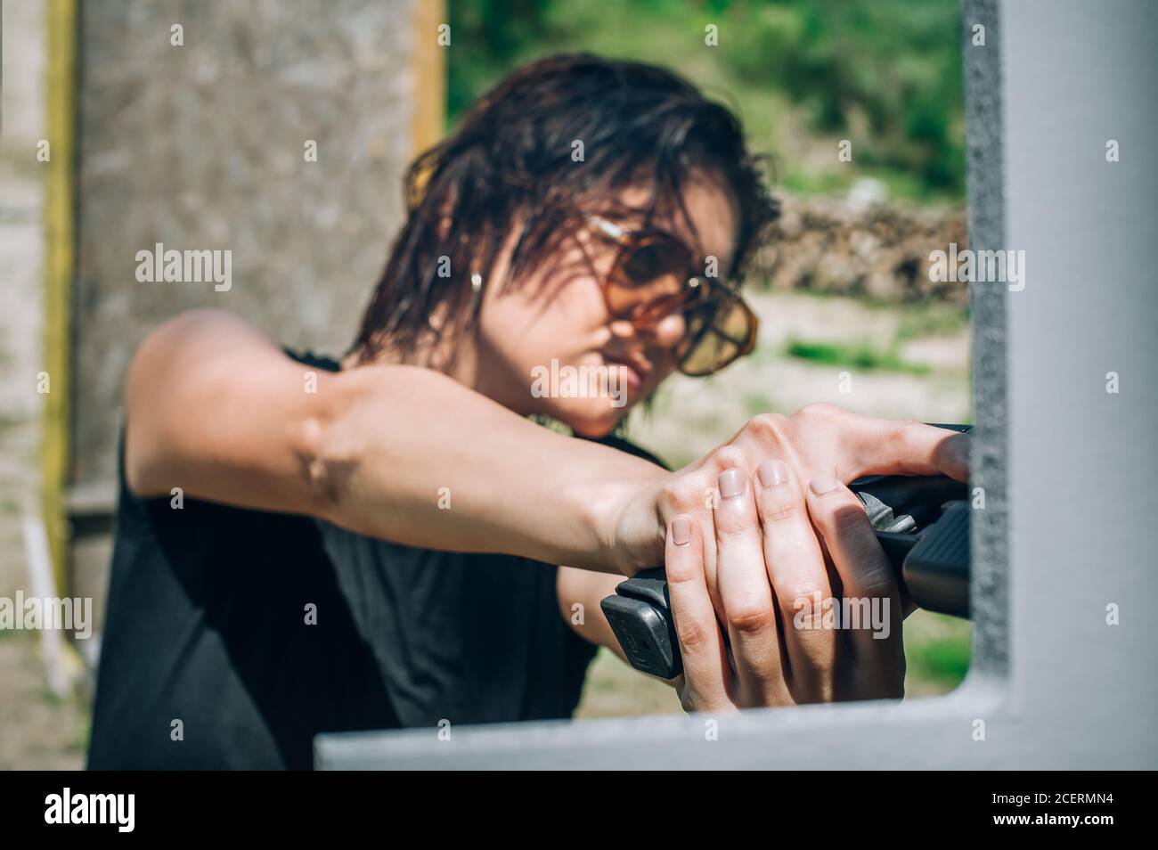 Close-up abstract view of attractive female army soldier have gun ...