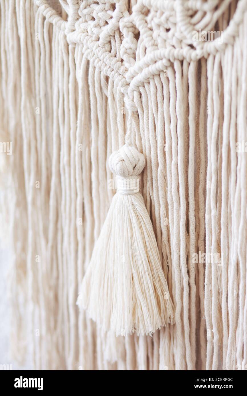 Handmade macrame 100% cotton wall decoration hanging on a white wall ...