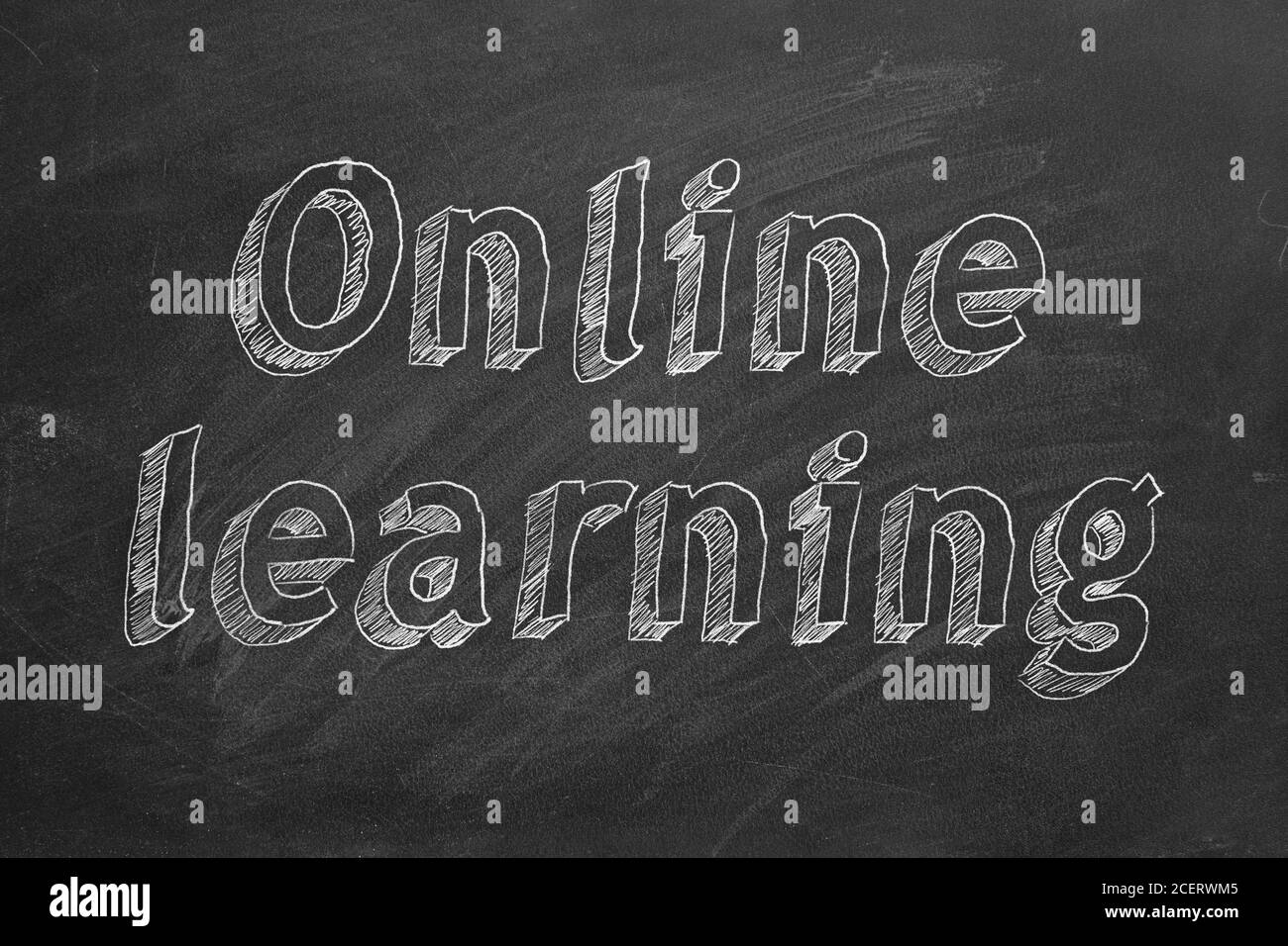 Hand drawing "Online learning" on black chalkboard Stock Photo - Alamy