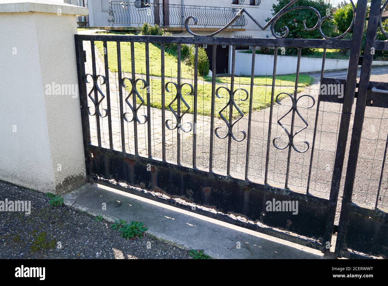 Old vintage rusty metal gate of private house Stock Photo - Alamy
