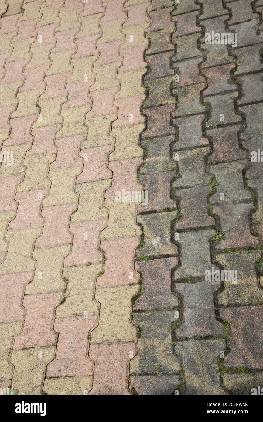 garden paved path that was half clean and dirty after an anti-foam ...