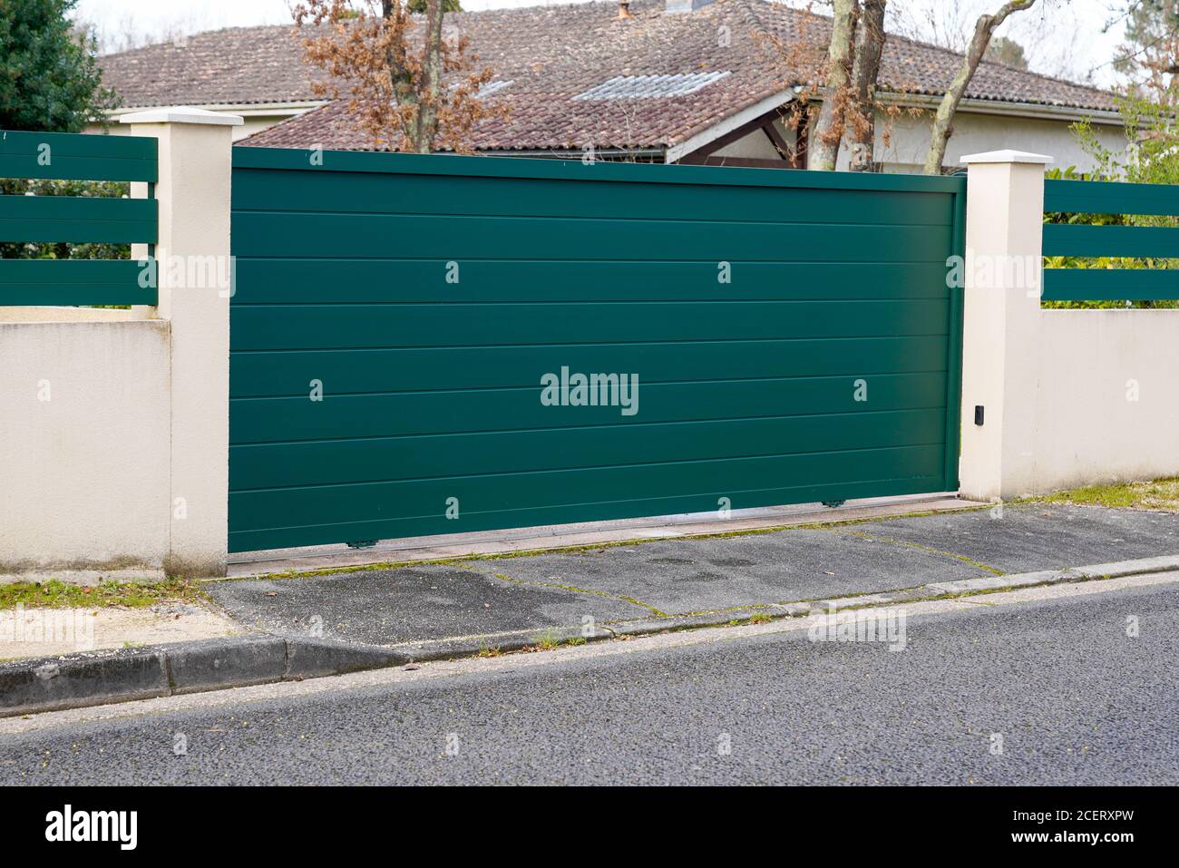 steel big green metal gate fence on modern house street Stock Photo - Alamy