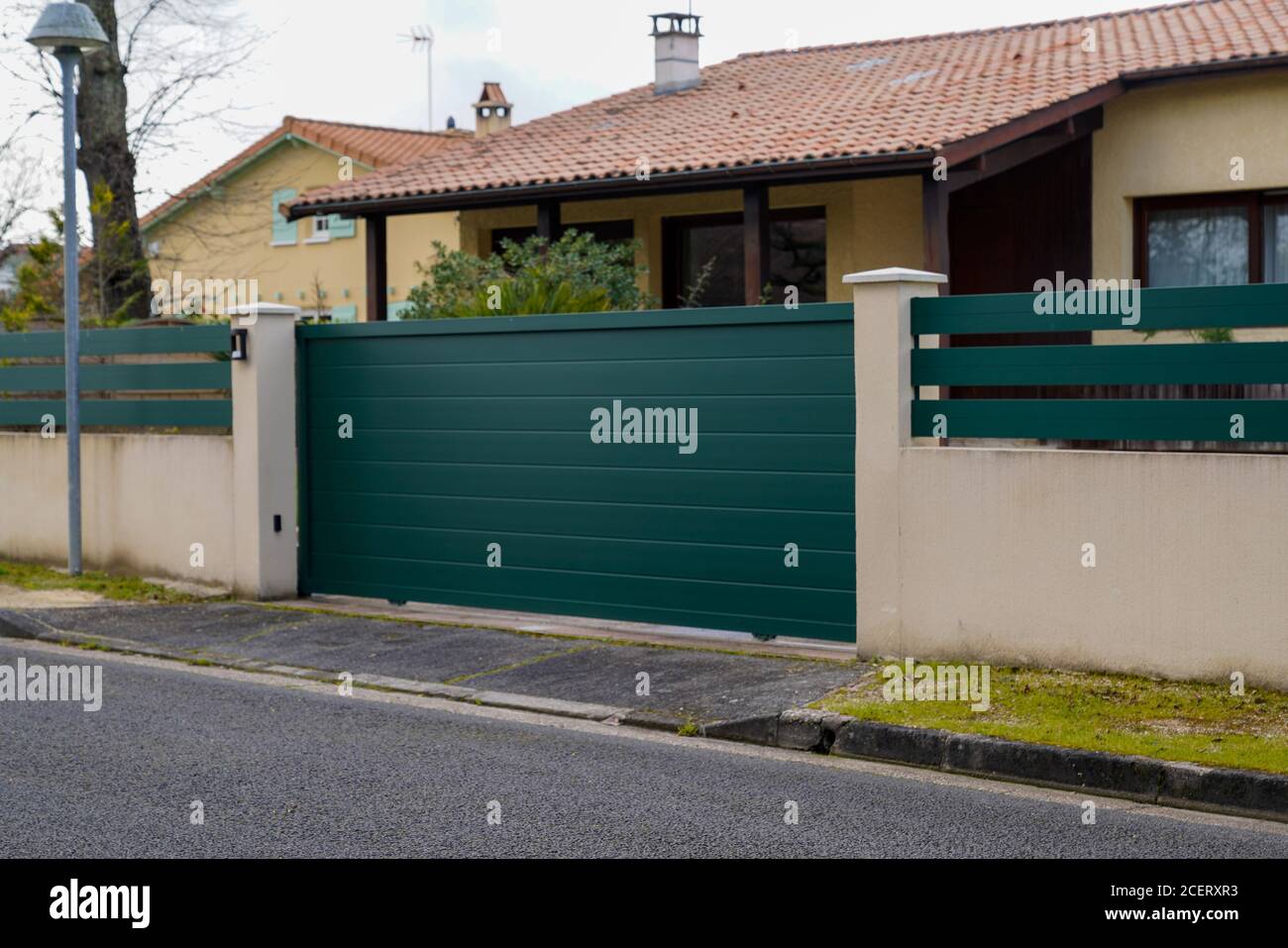 green design metal aluminum gate of modern house Stock Photo - Alamy