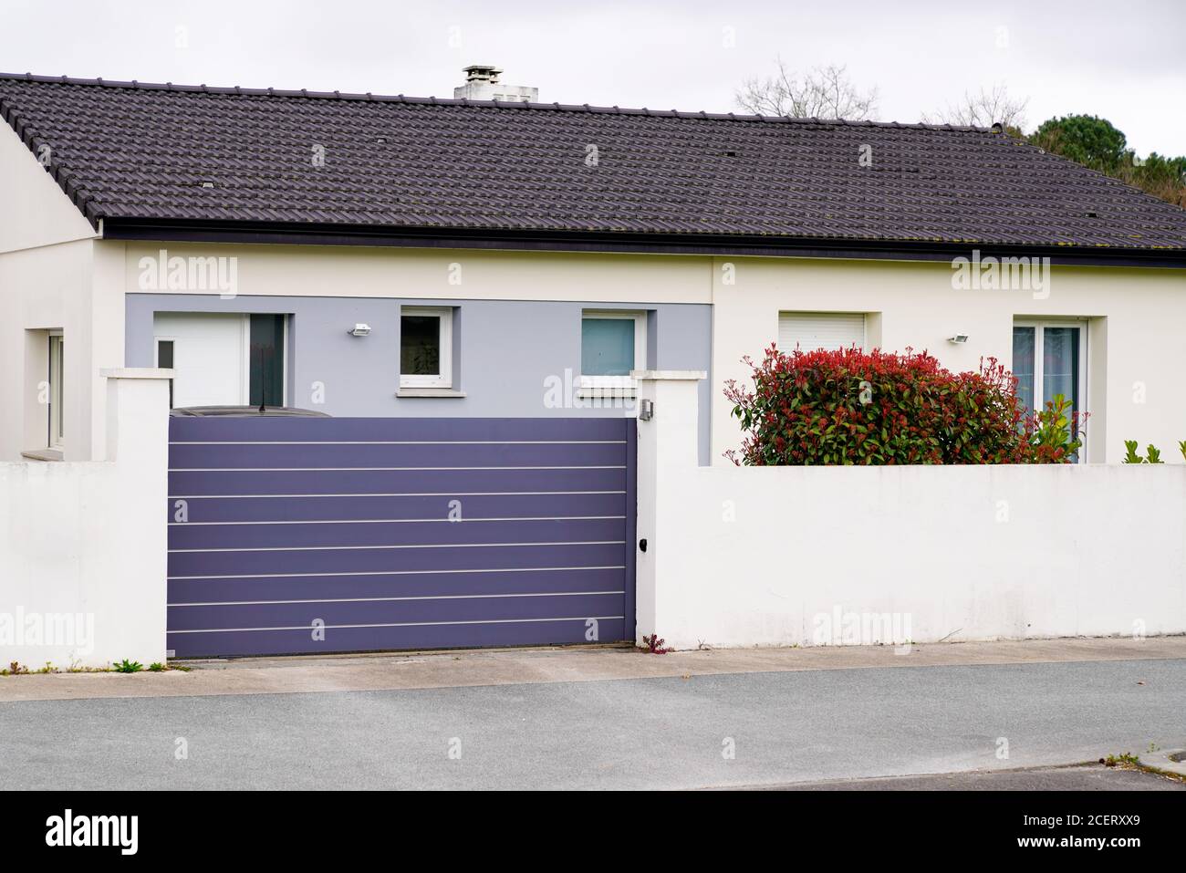 Metal grey driveway entrance gates house access garage in suburb Stock ...