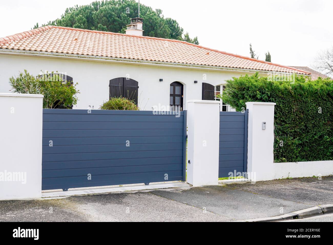 Aluminum gray gate and portal of suburb house Stock Photo - Alamy