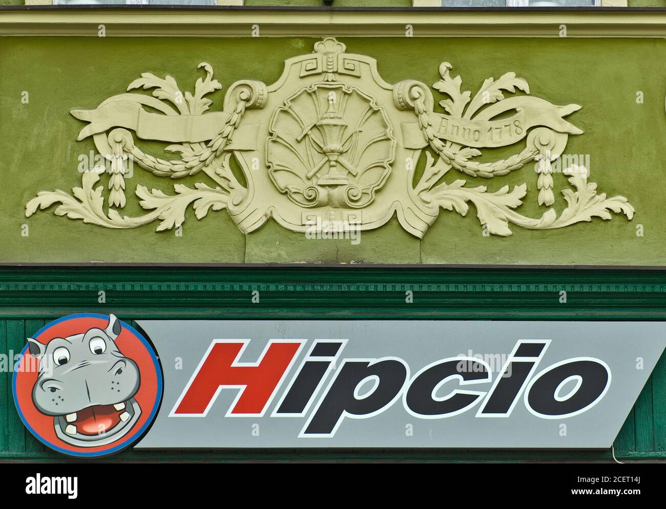 Historic cartouche and modern Hippo toy store sign at house at Rynek ...