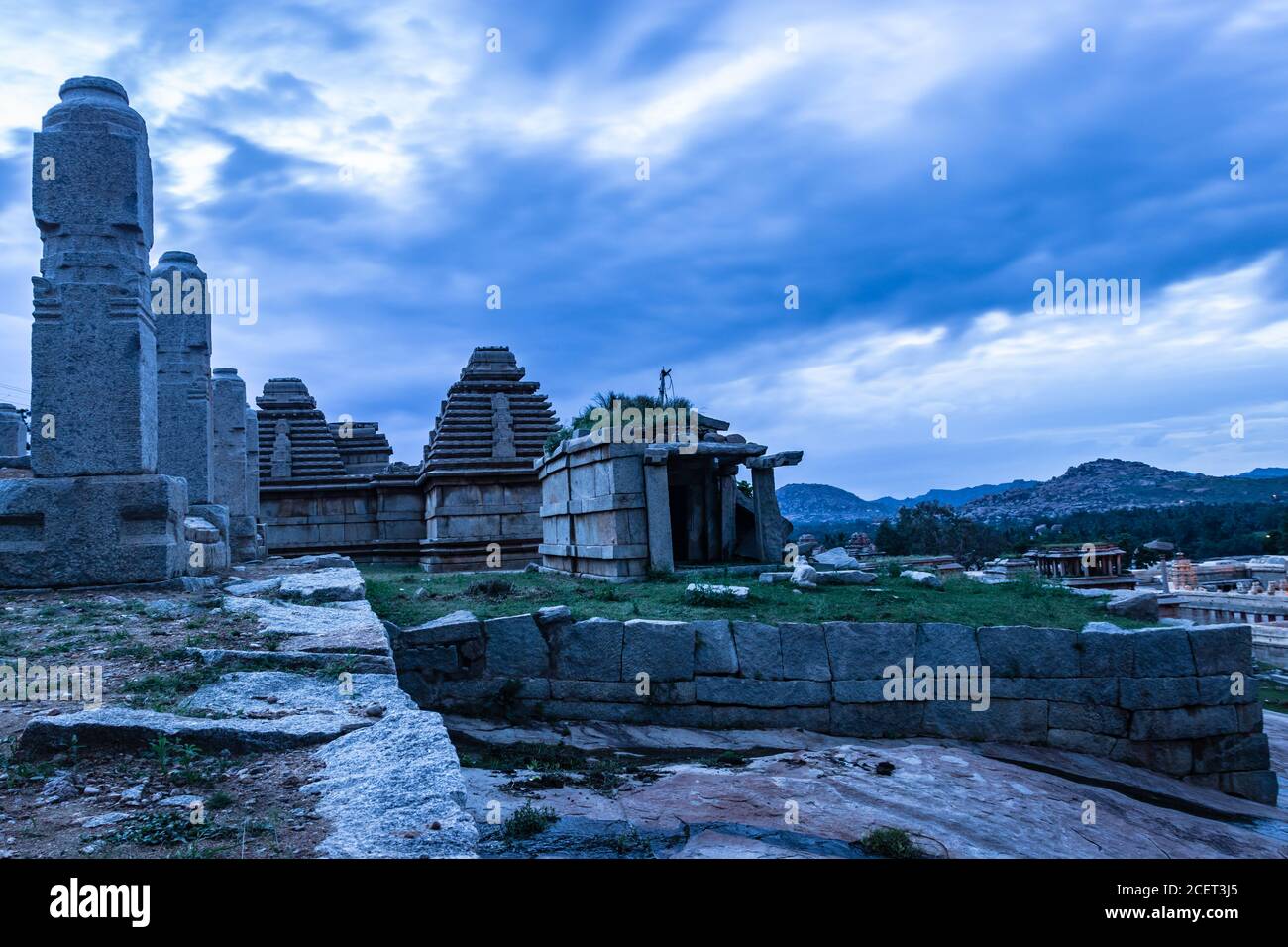 hampi ruins ancient stone art with dramatic sky flat angle shot is ...