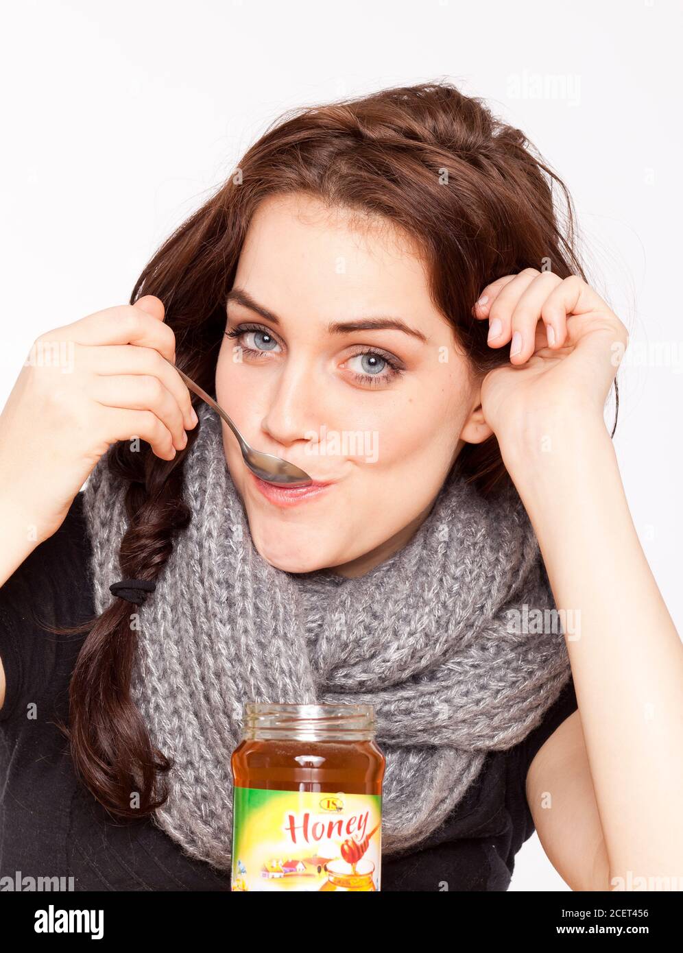 Beautiful woman eating honey hi-res stock photography and images - Alamy