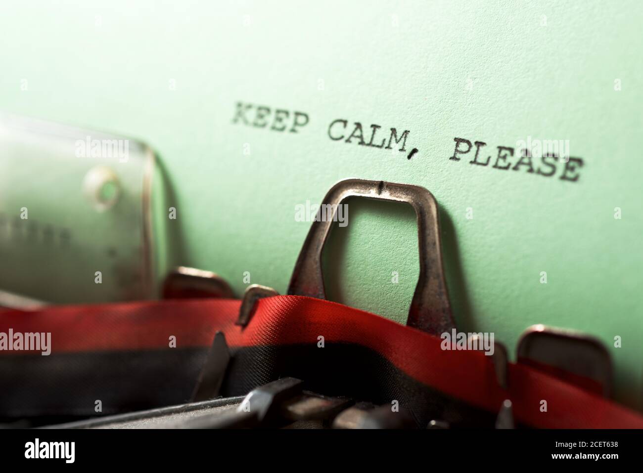 Keep calm, please written with a typewriter Stock Photo - Alamy