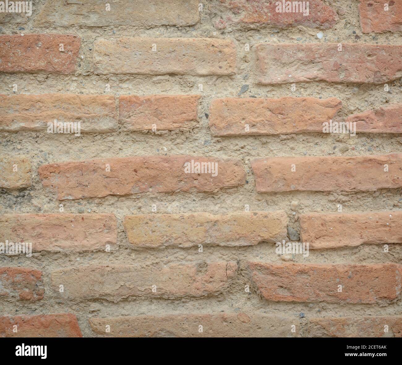 Red-orange long bricks of an ancient wall Stock Photo - Alamy