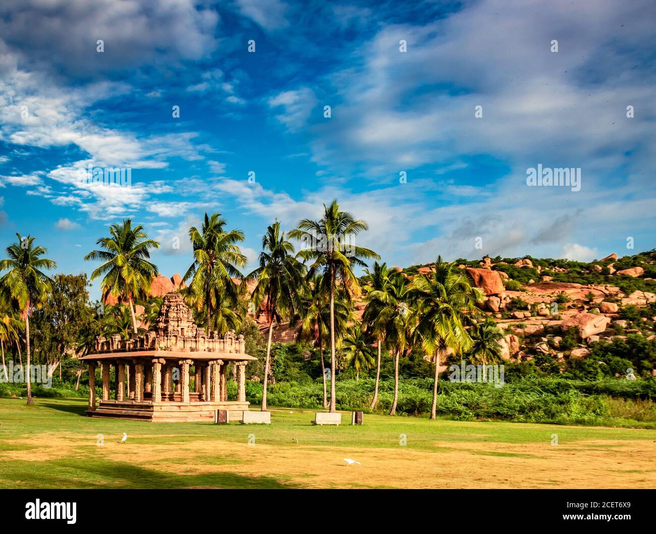 hampi ruins ancient breathtaking stone art with bright blue sky flat ...