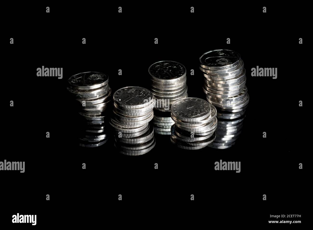 Silver Czech coins on black glass. Payment in the Czech Republic. Coins ...