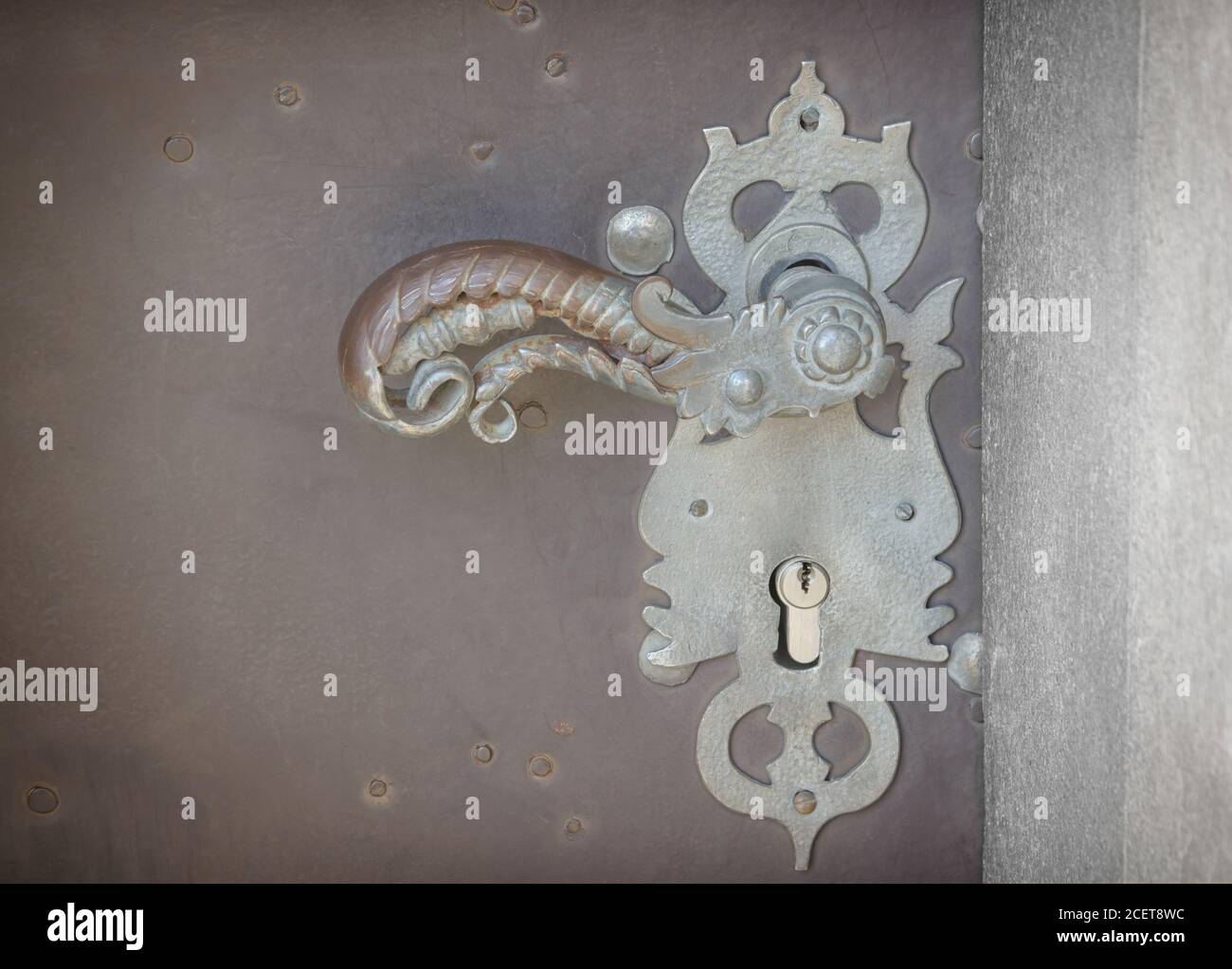 The ancient metal decorative handle at doors Stock Photo - Alamy