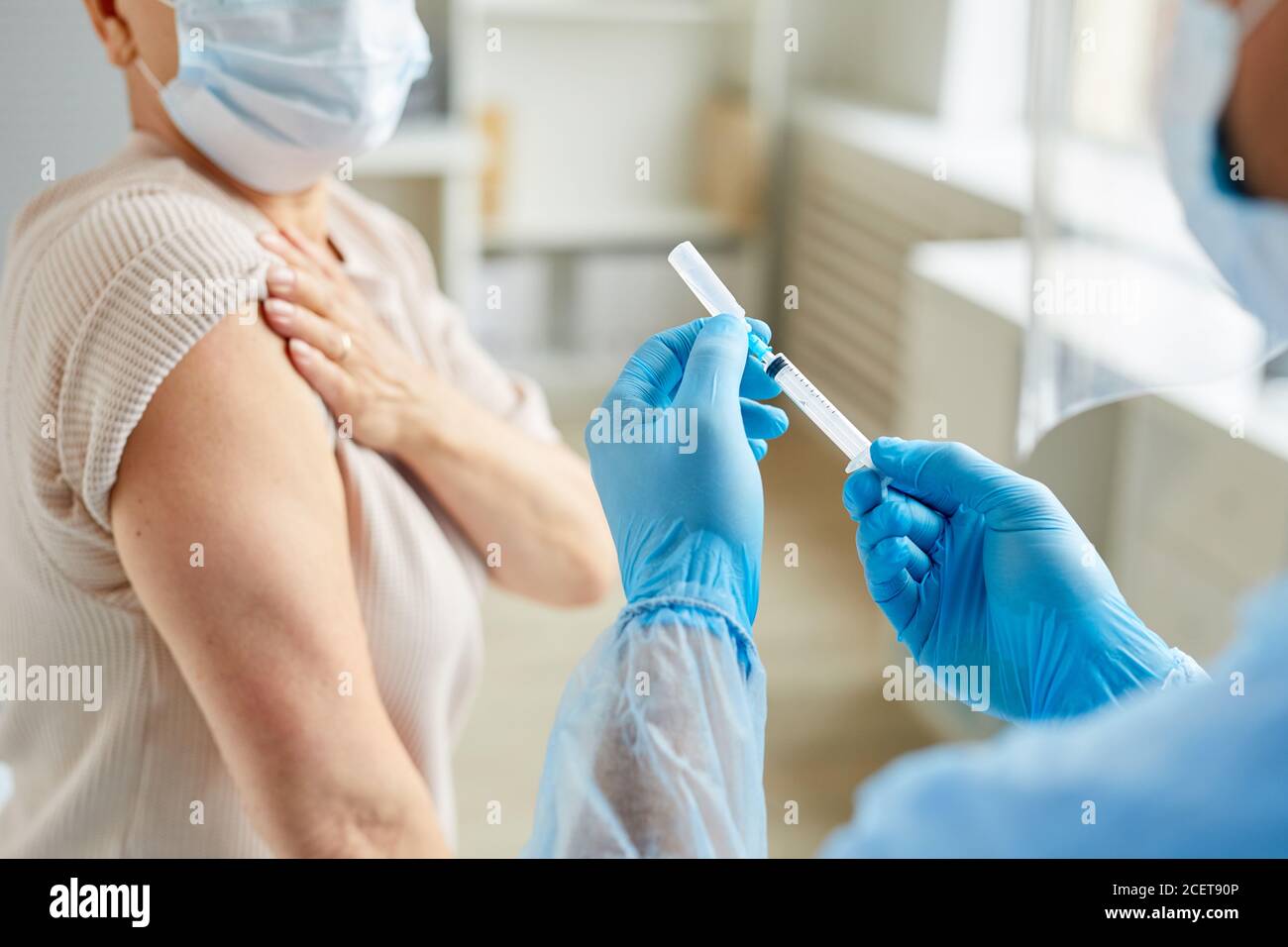 Nurse giving male patient injection hi-res stock photography and images ...