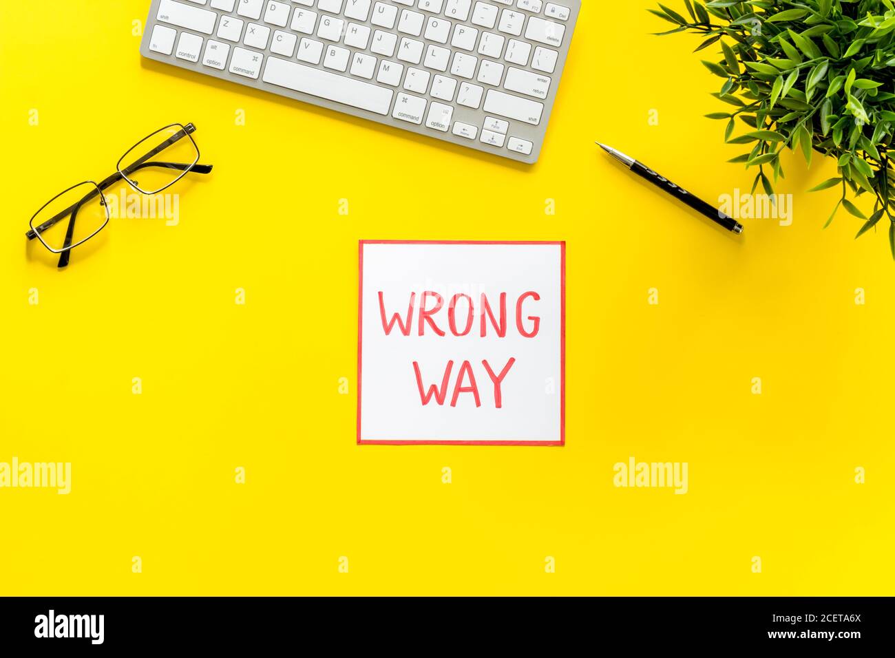 Business failure. Wrong way icon in hands on office desk top-down Stock ...