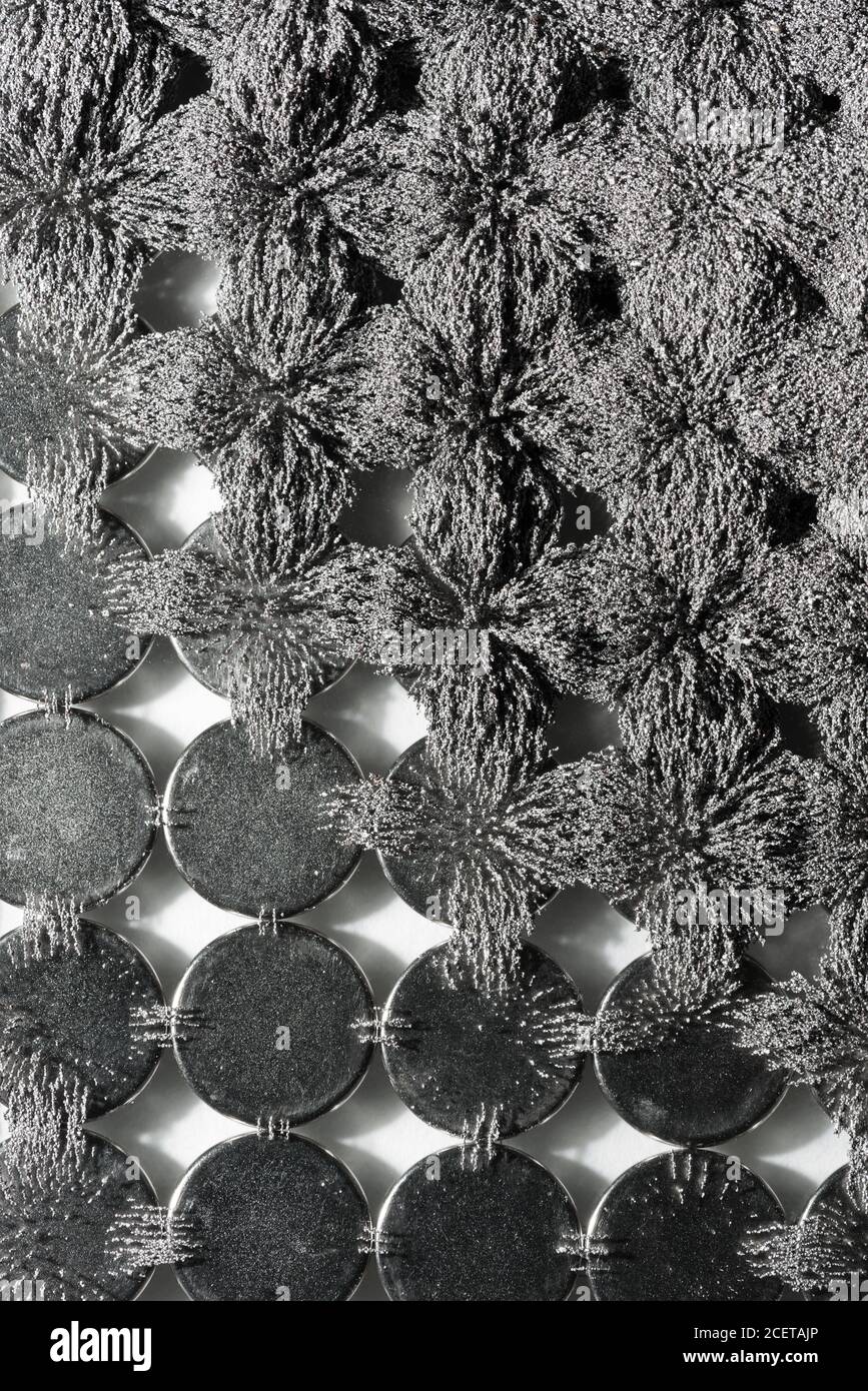 Invisible magnetic flux made visible with iron filings creating ...