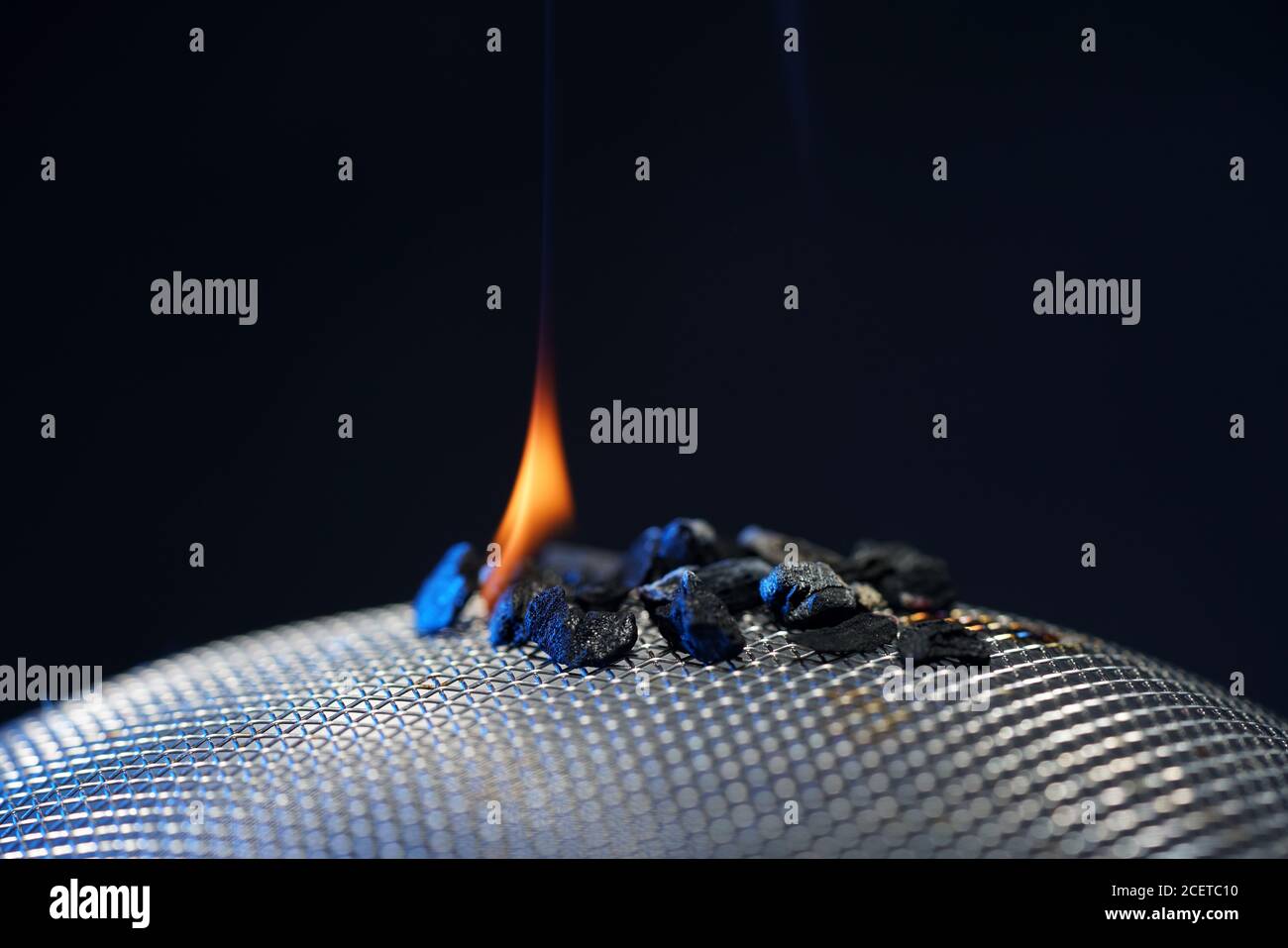 Coal on a metal surface Stock Photo - Alamy