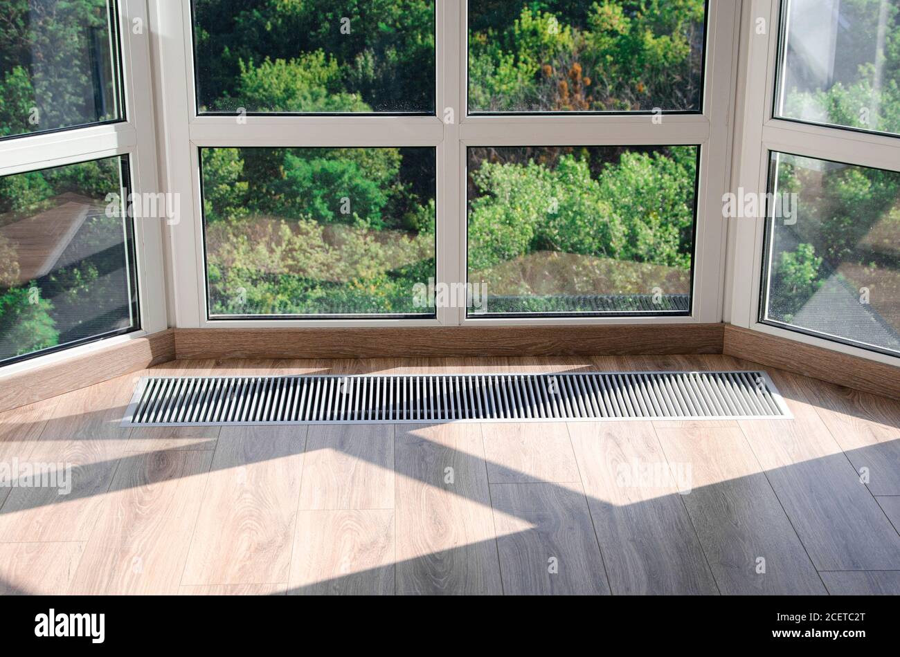 Protective grille mounted on the floor to heat the panoramic window ...