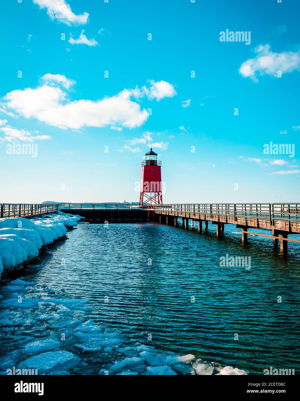 Lake Michigan thawing out at the South Pier lighthouse in Charlevoix MI ...