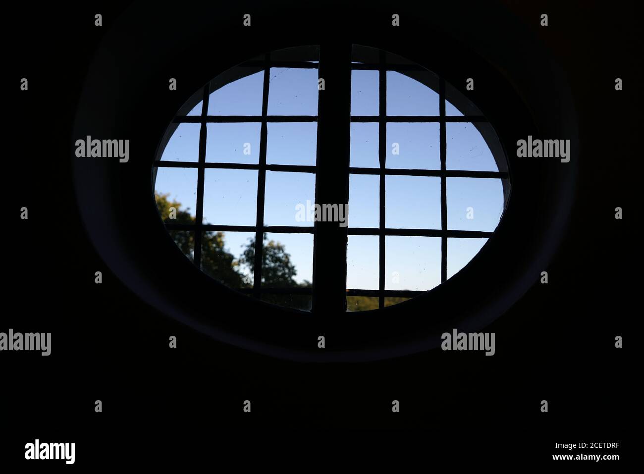 View inside an underground tunnel with a barred opening gates Stock ...