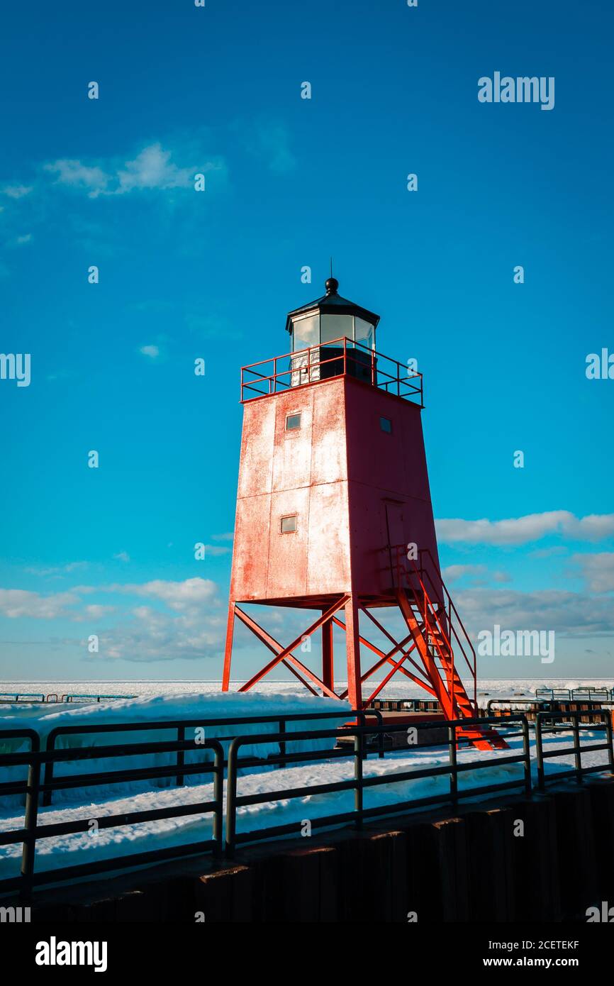 Prime look at bold red South Pier Lighthouse in Charlevoix Michigan ...