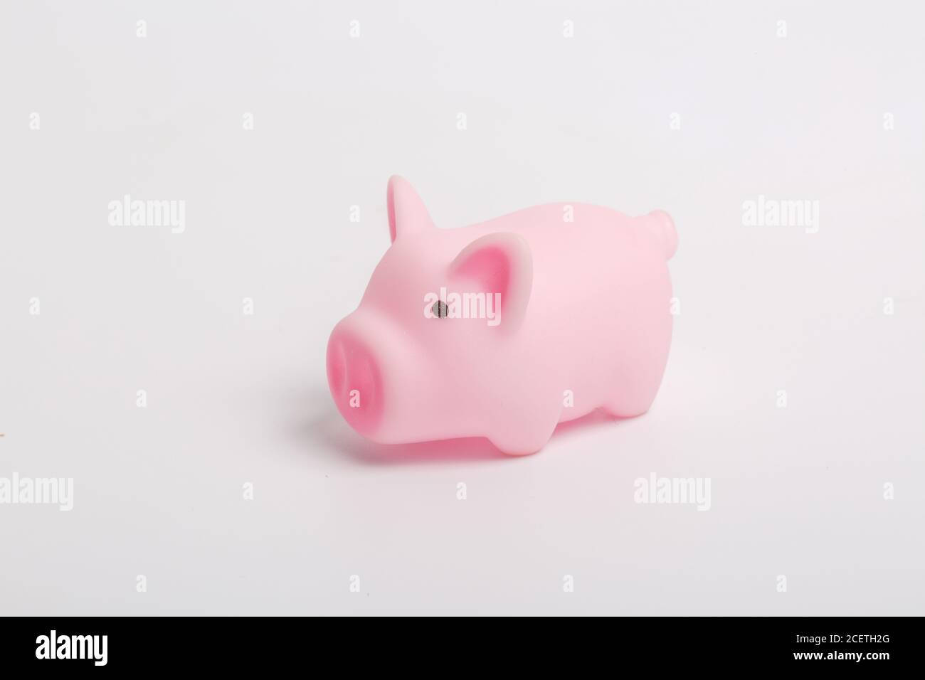 Cute little pink pig ornament on white background Stock Photo - Alamy
