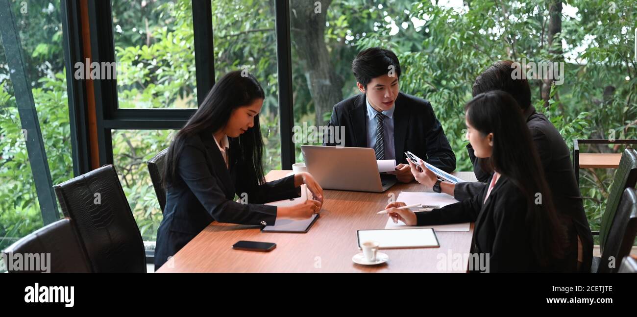 Businesspeople are working together in a comfortable conference room ...