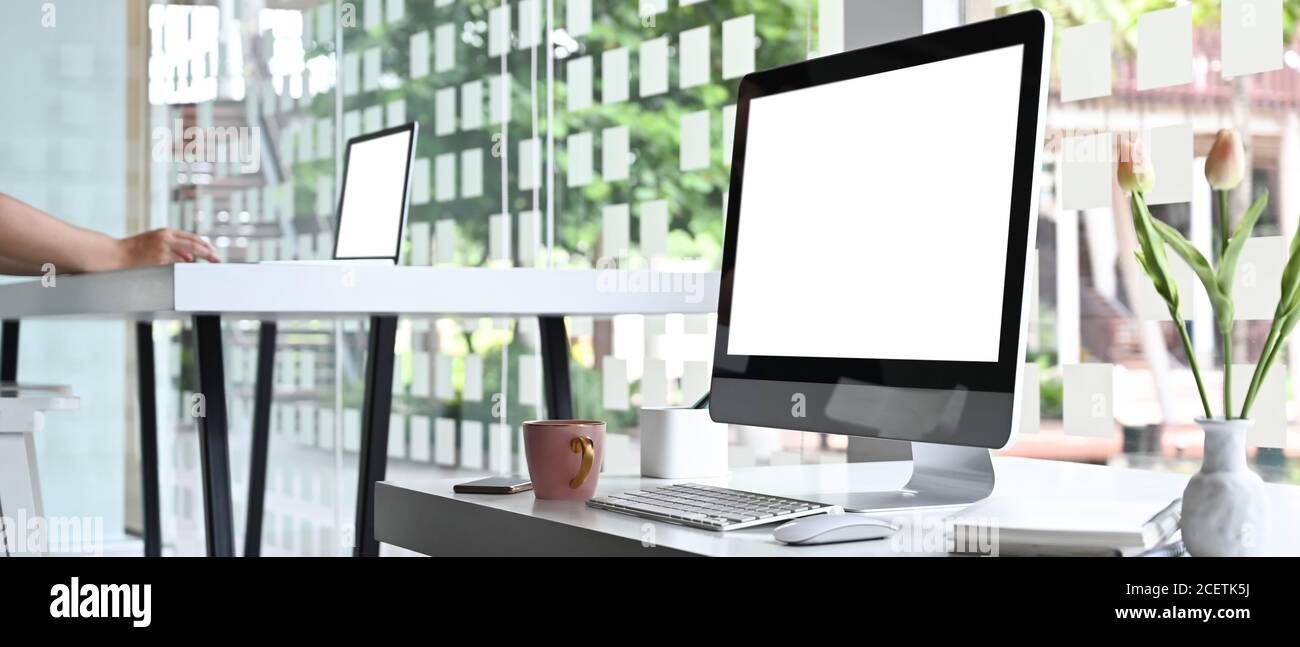 A computer monitor with a white blank screen is putting on a white ...