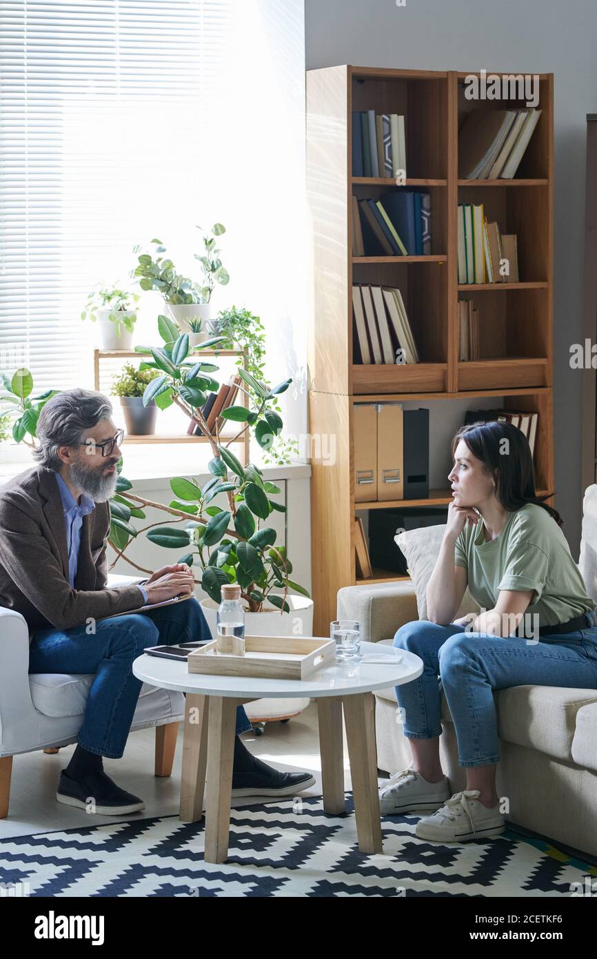 Vertical side view shot of modern woman feeling stress sharing her ...