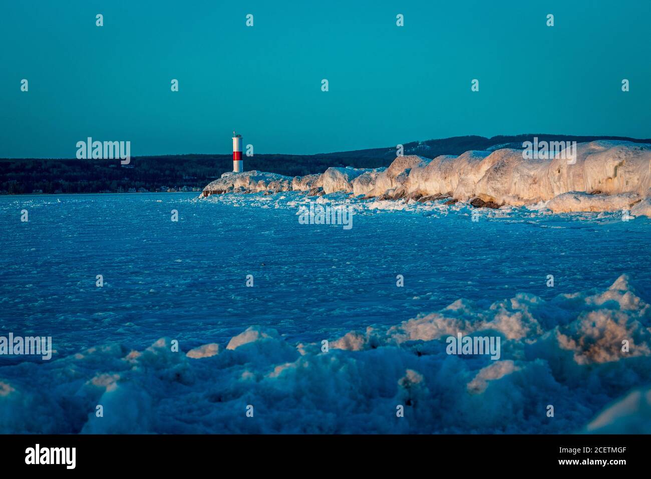 Landscape shot of an icy lighthouse in Petoskey Michigan Stock Photo ...