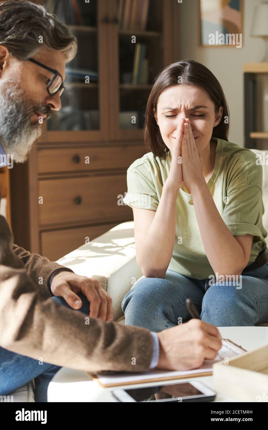 Doctor comforting crying patient hi-res stock photography and images ...