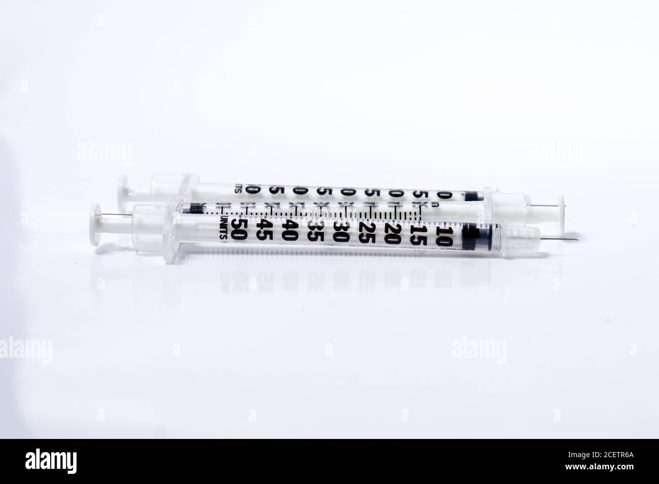 syringe over white background Stock Photo - Alamy