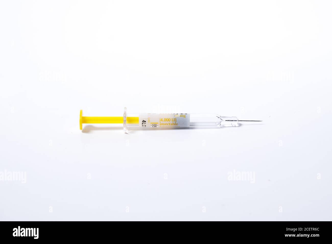 syringe over white background Stock Photo - Alamy