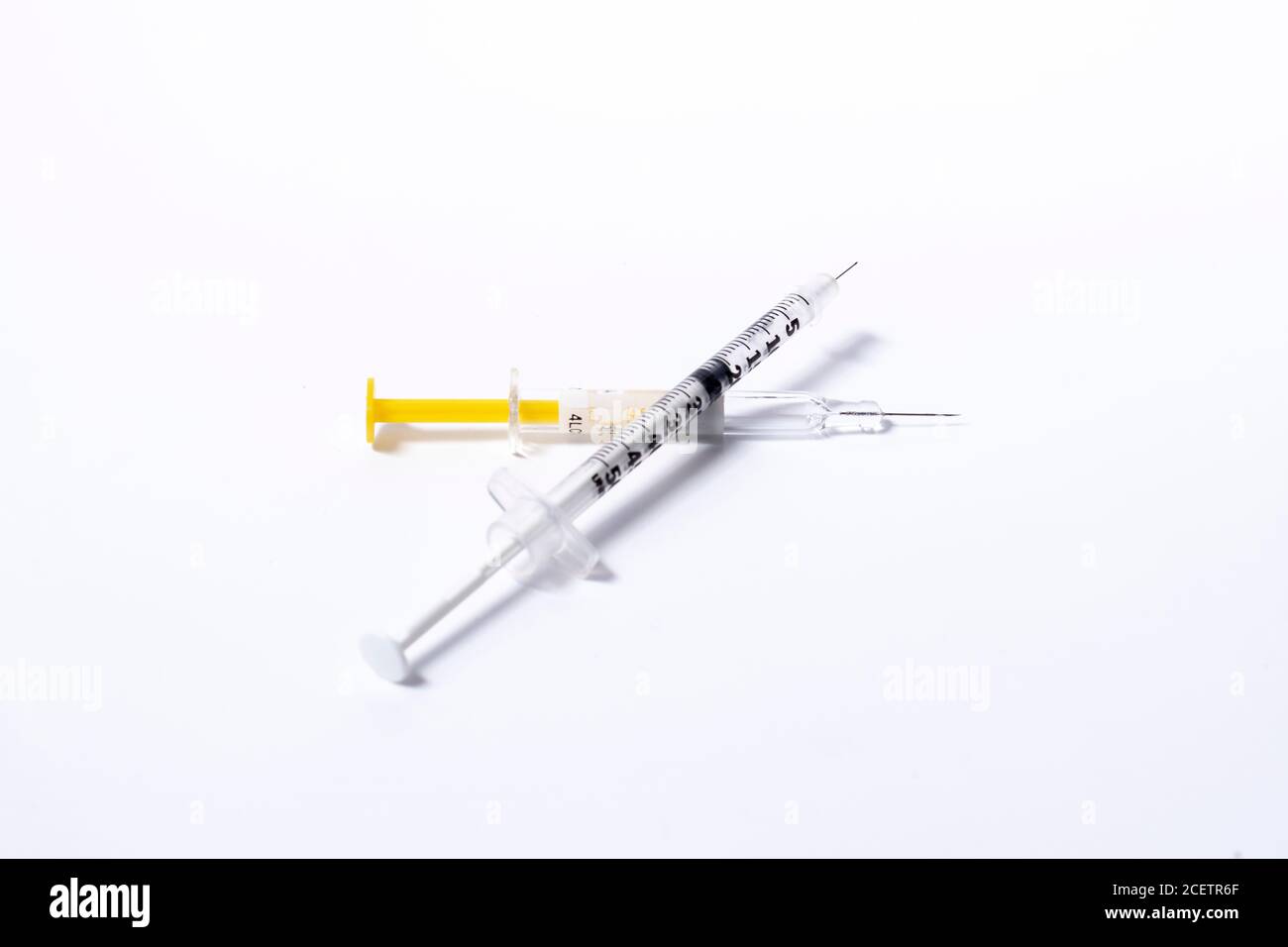 syringe over white background Stock Photo - Alamy
