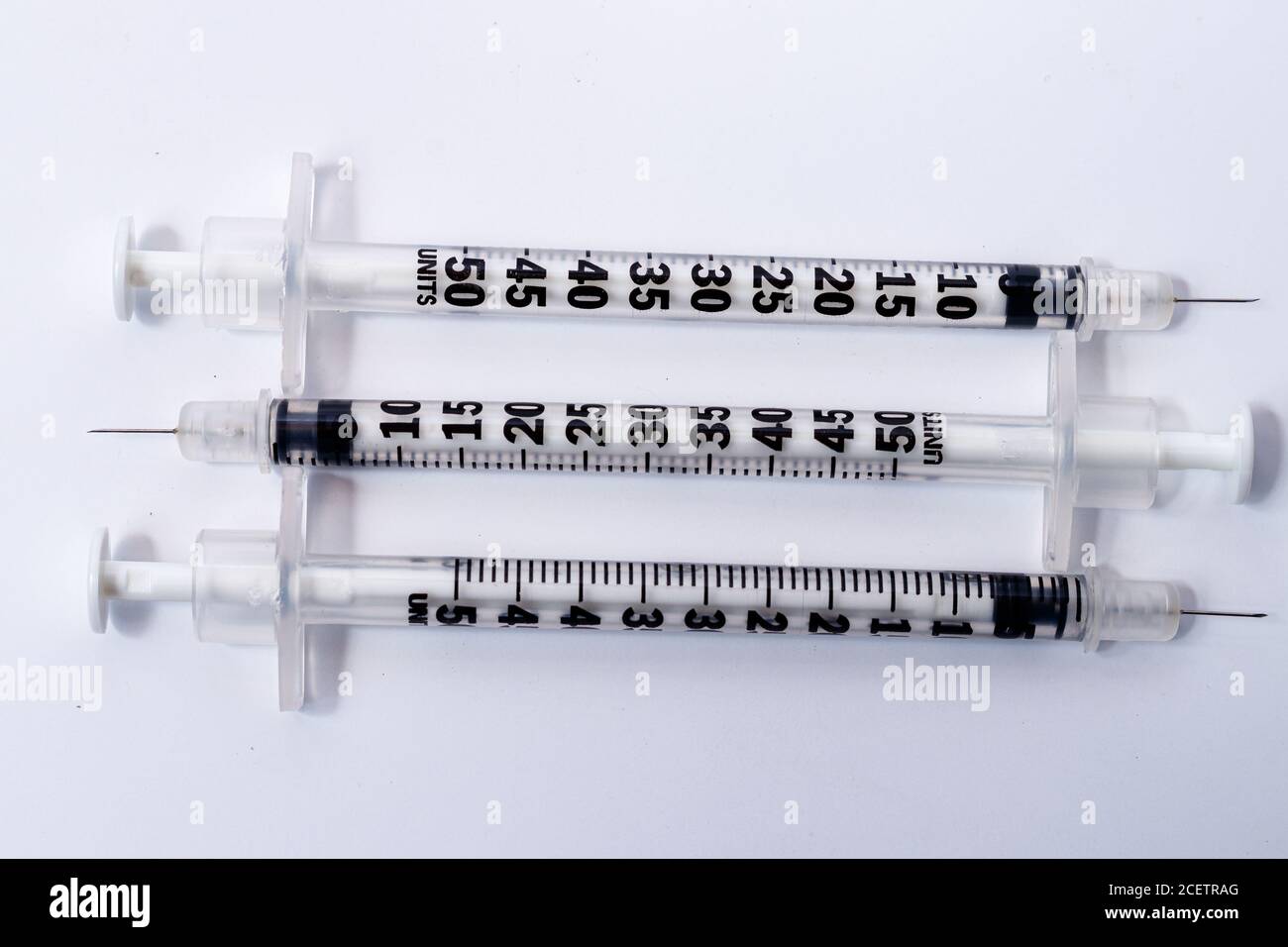 syringe over white background Stock Photo - Alamy