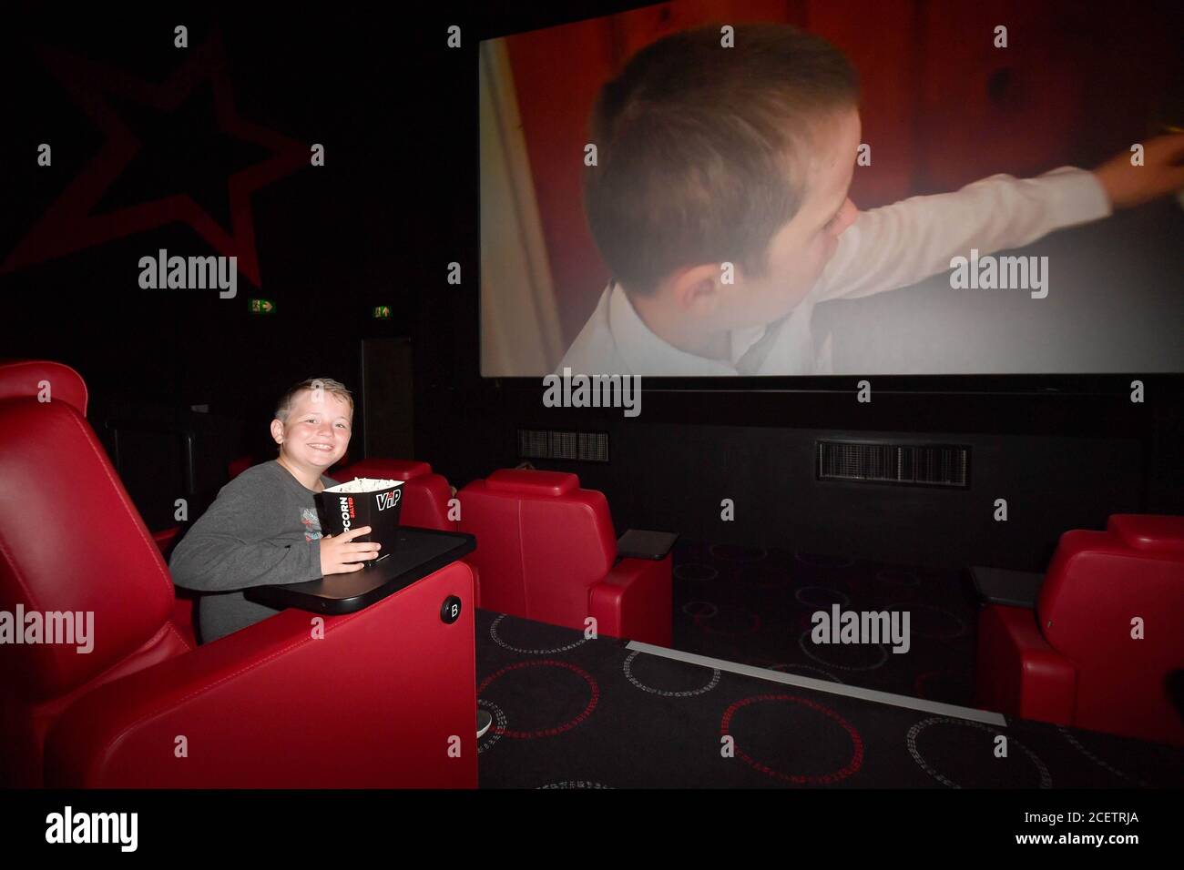 EDITORIAL USE ONLY Billy Neal age 8, reacts to seeing himself in the ...