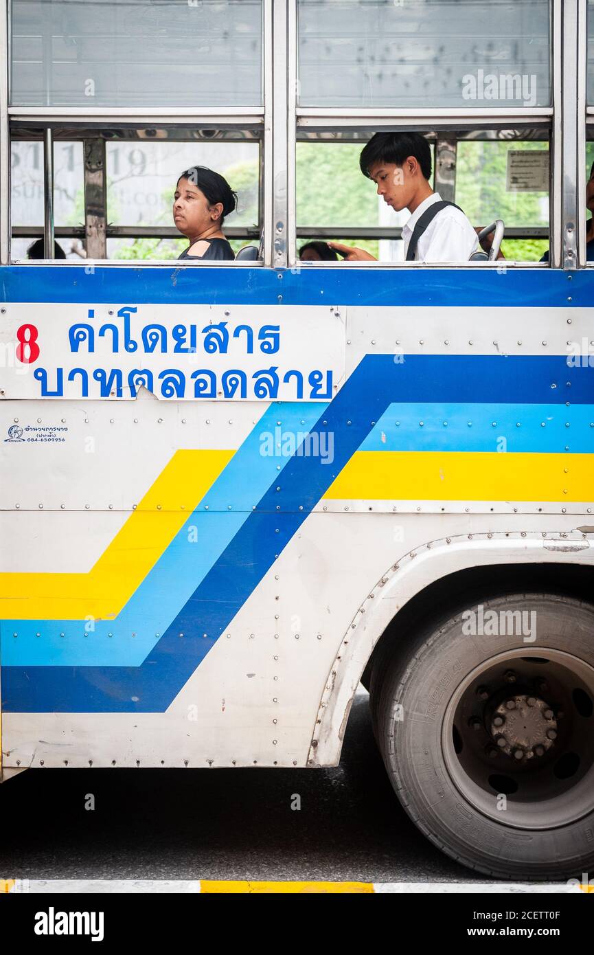 A typical Thai public bus makes its way along Sukhumvit Rd. Bangkok ...