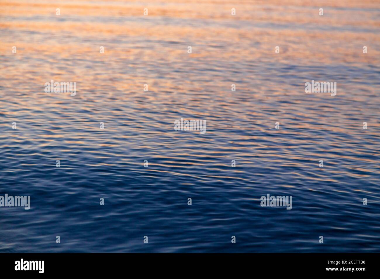 Clear water texture in blue and orange. Background of the ocean and the ...