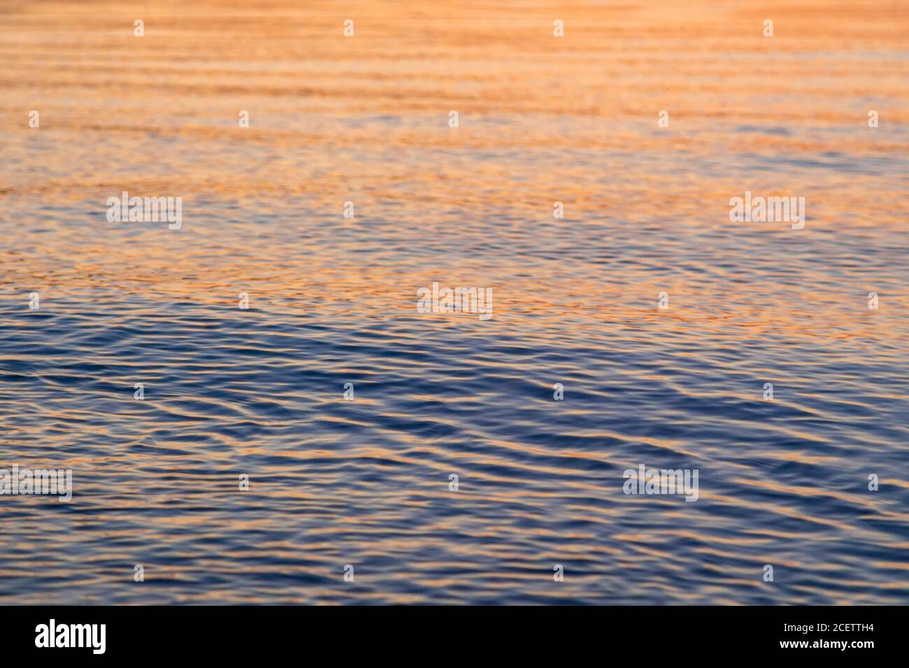 Clear water texture in blue and orange. Background of the ocean and the ...