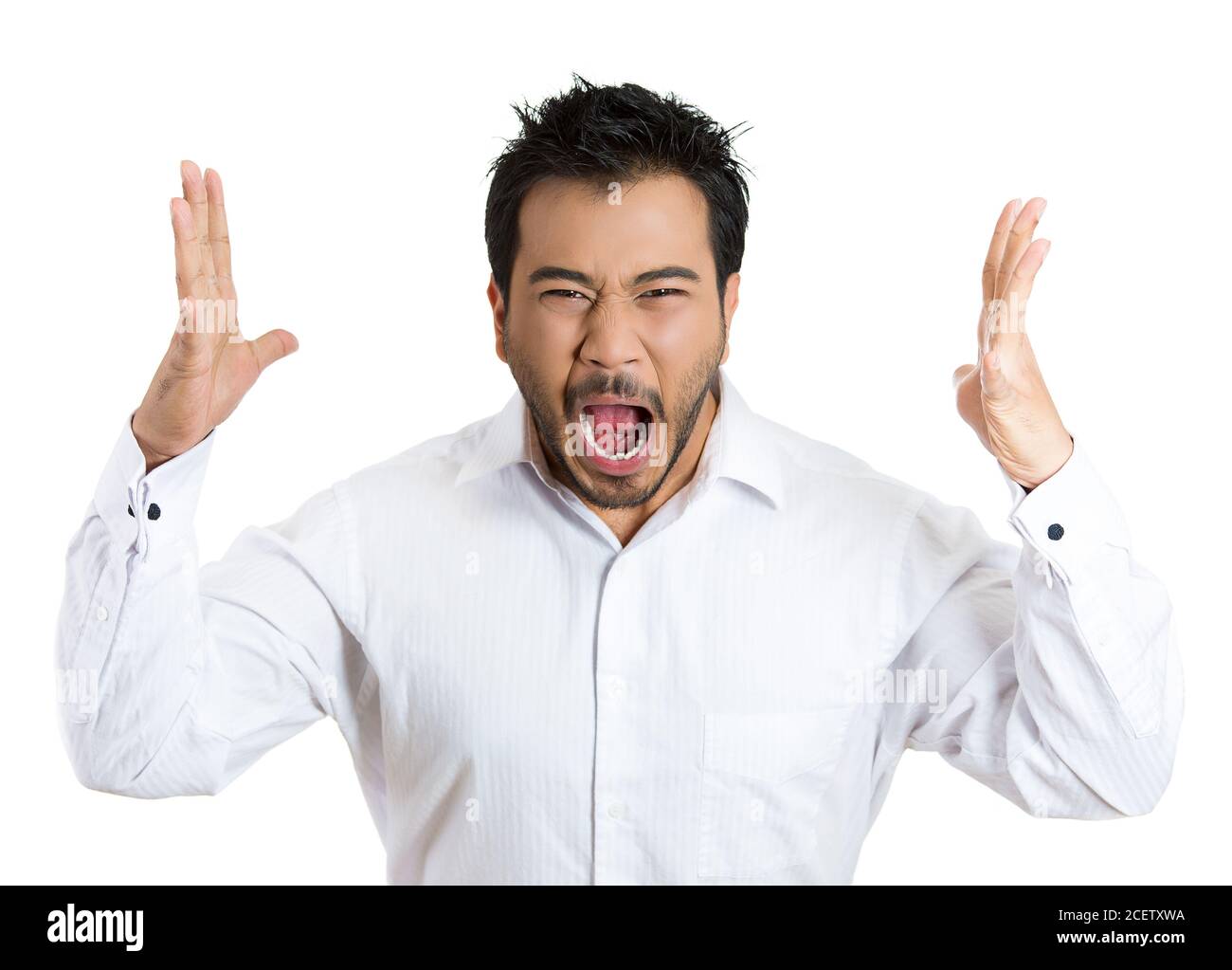 Portrait of an angry man with hands in air, wide open mouth yelling ...